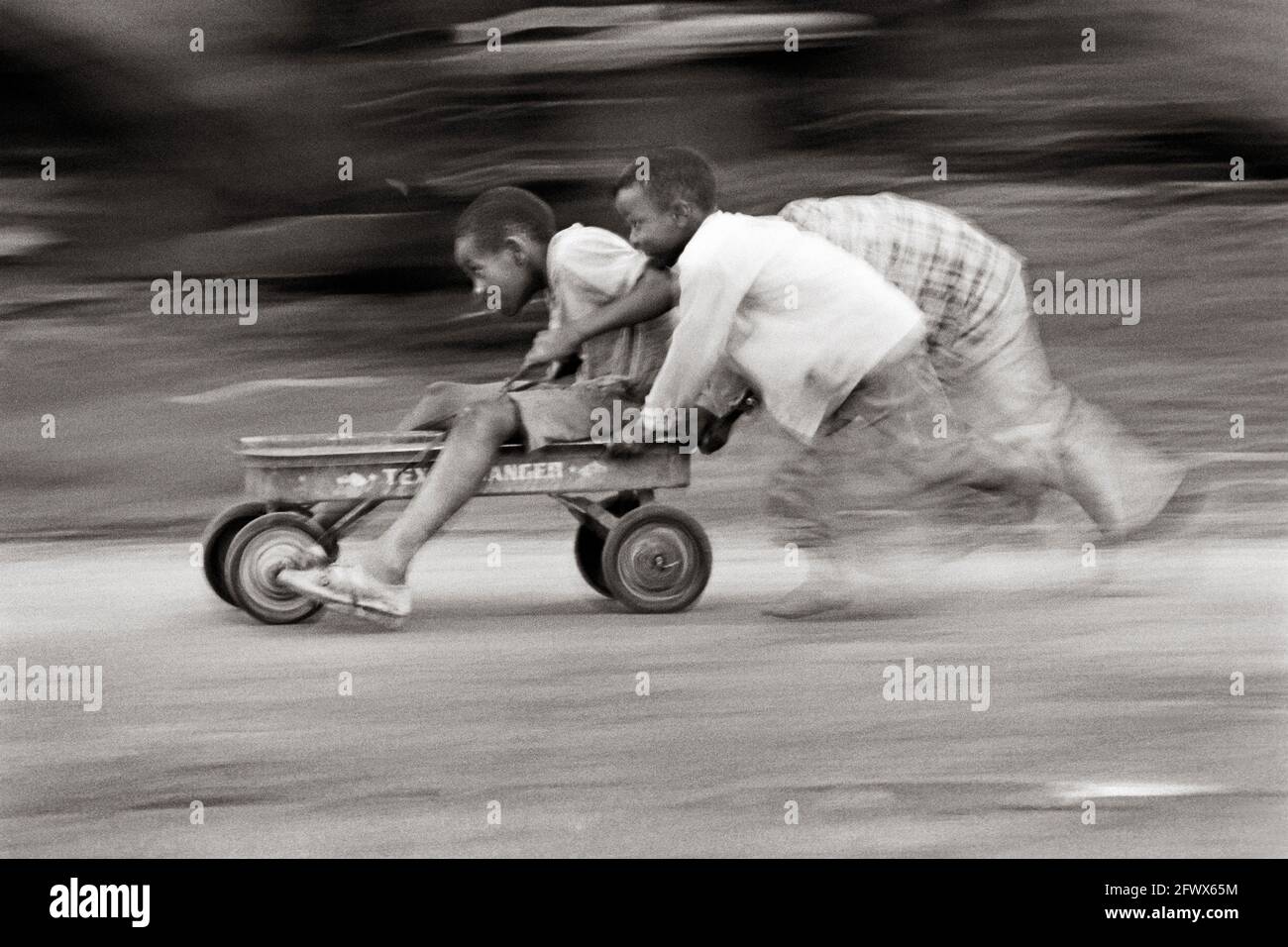 Kids with Texas Ranger Wagon Stock Photo - Alamy