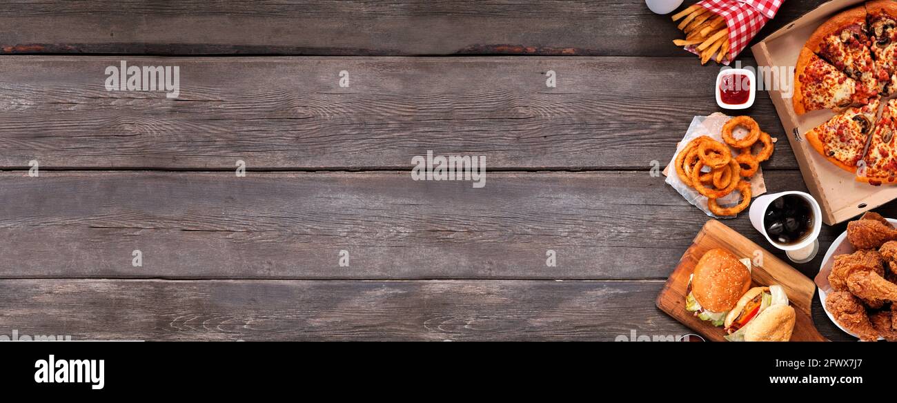 Assorted take out or delivery foods. Side border. Pizza, hamburgers ...