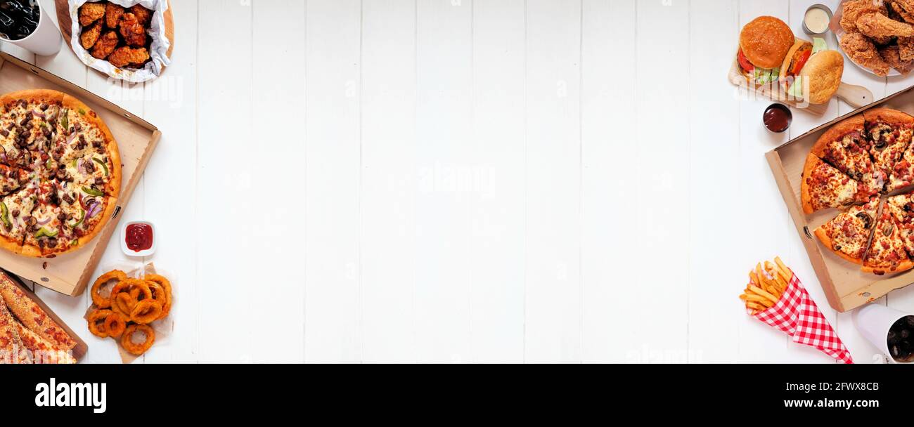 Assortment of take out or delivery foods. Pizza, hamburgers, fried ...