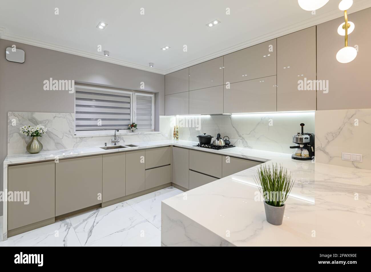 Luxury white modern marble kitchen in studio space Stock Photo - Alamy