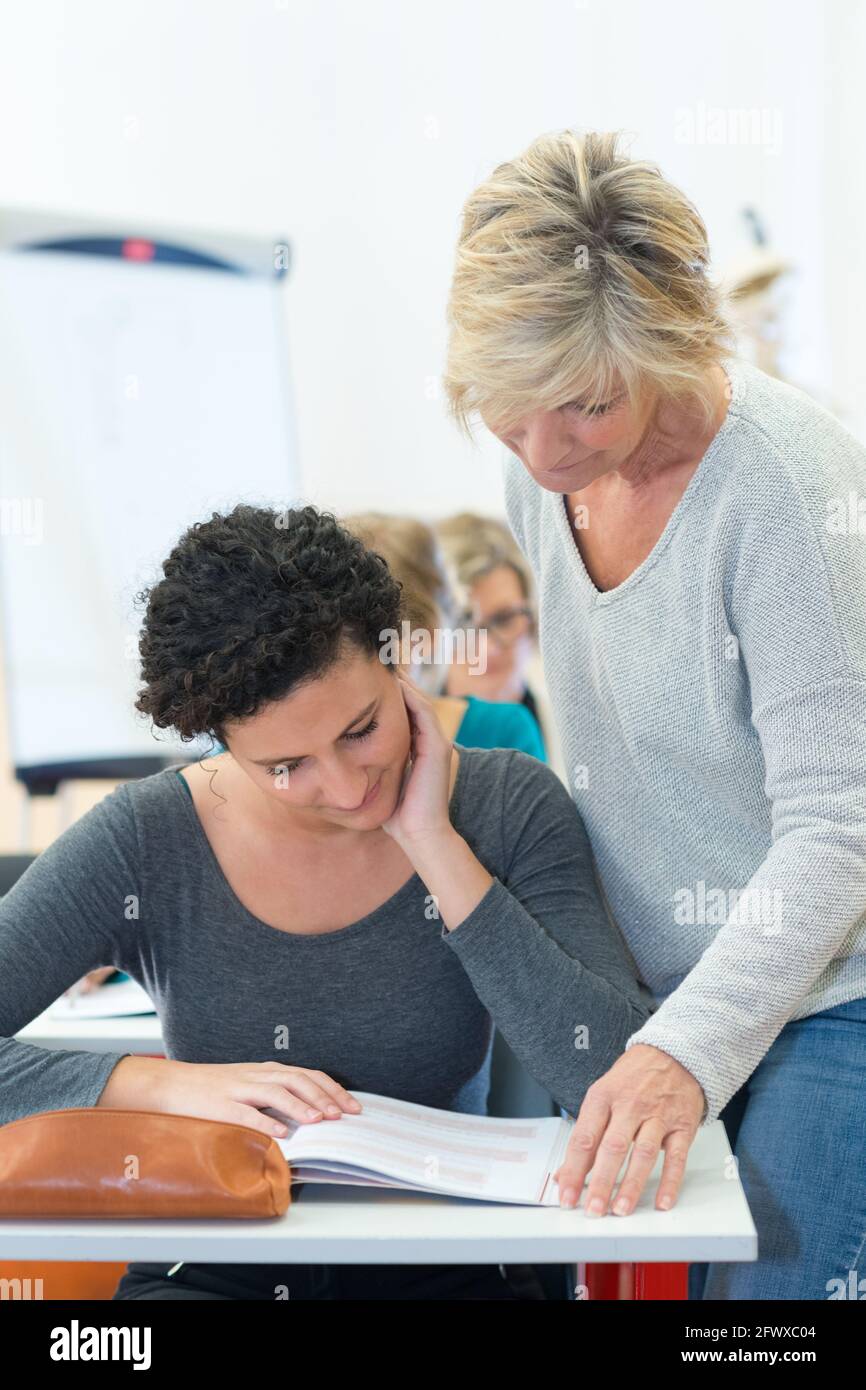 professor helping a female student Stock Photo - Alamy