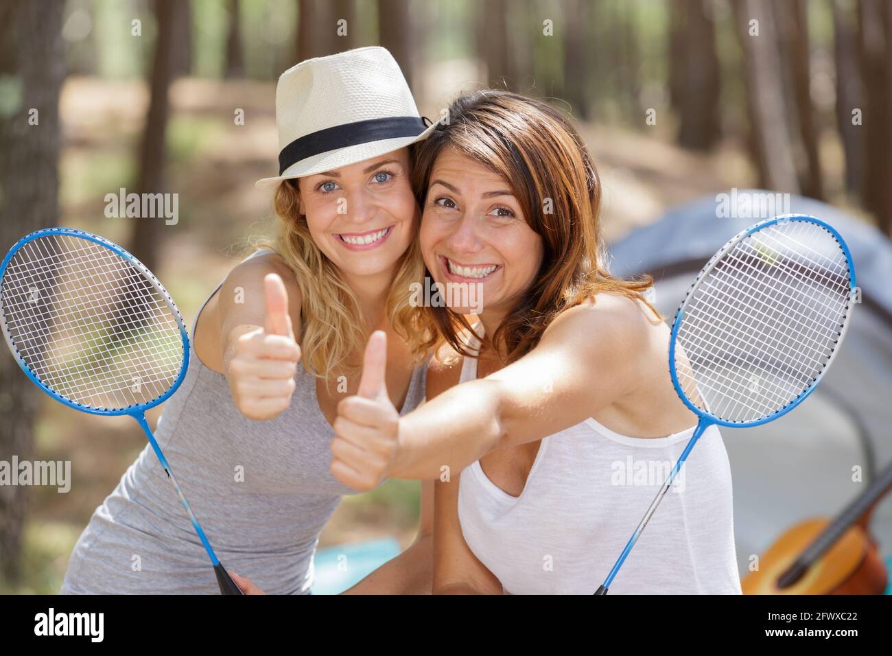 happy friends playing badminton at summer garden Stock Photo - Alamy