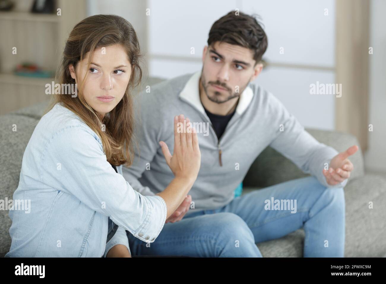 woman ignoring boyfriend after an argument Stock Photo - Alamy