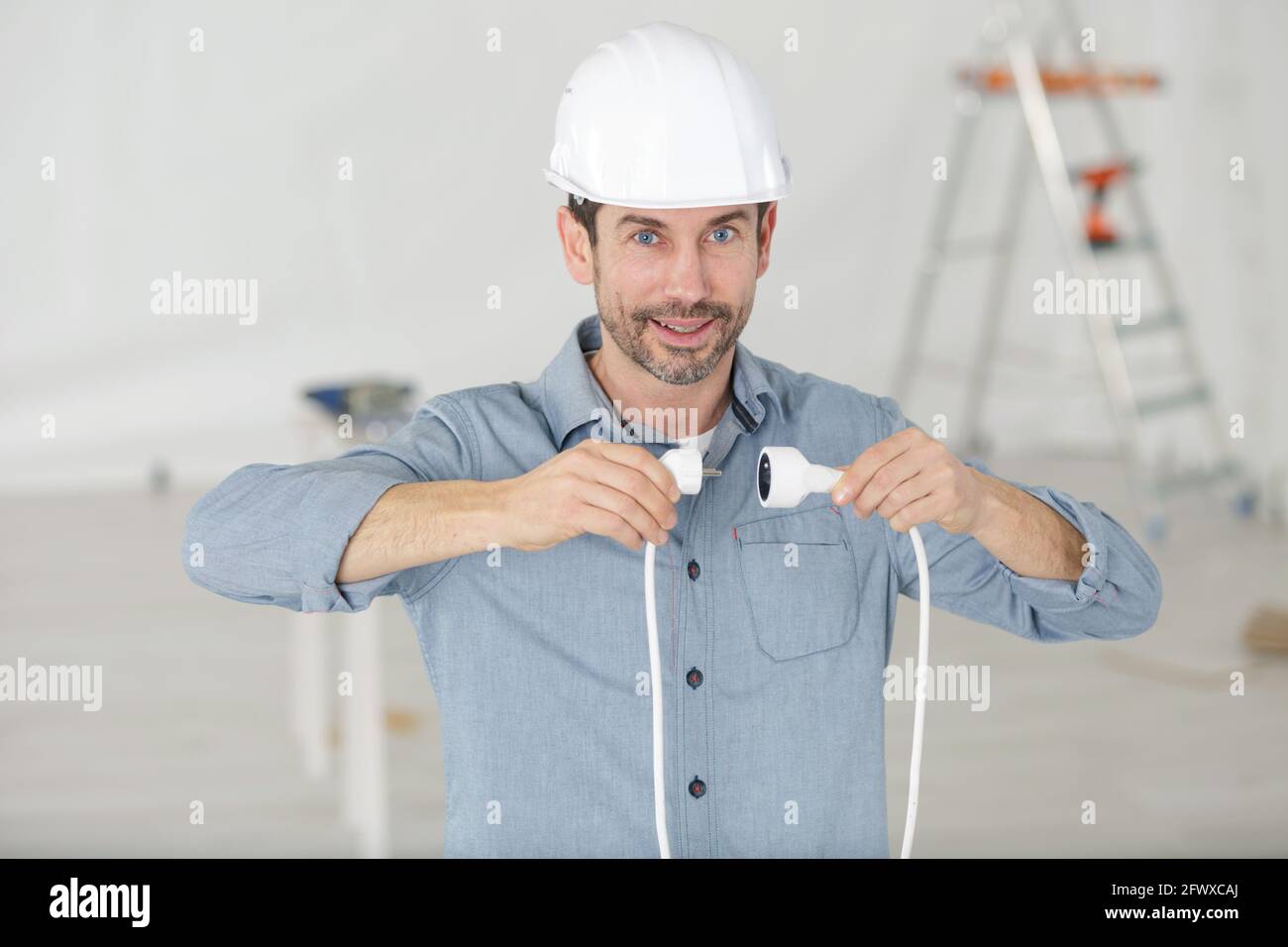 a handsome electrician at work Stock Photo - Alamy