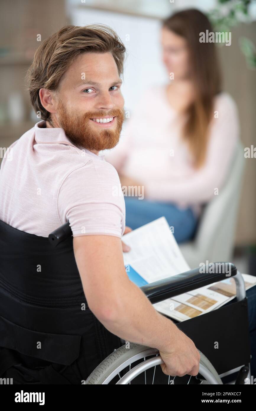 happy handsome man in wheelchair Stock Photo - Alamy