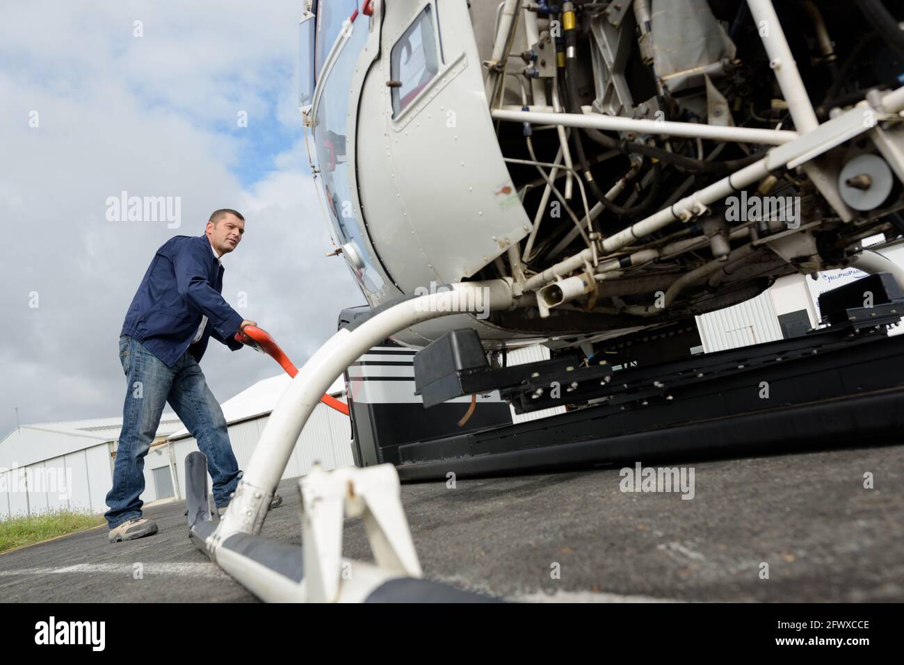 a helicopter lifting the equipment Stock Photo - Alamy