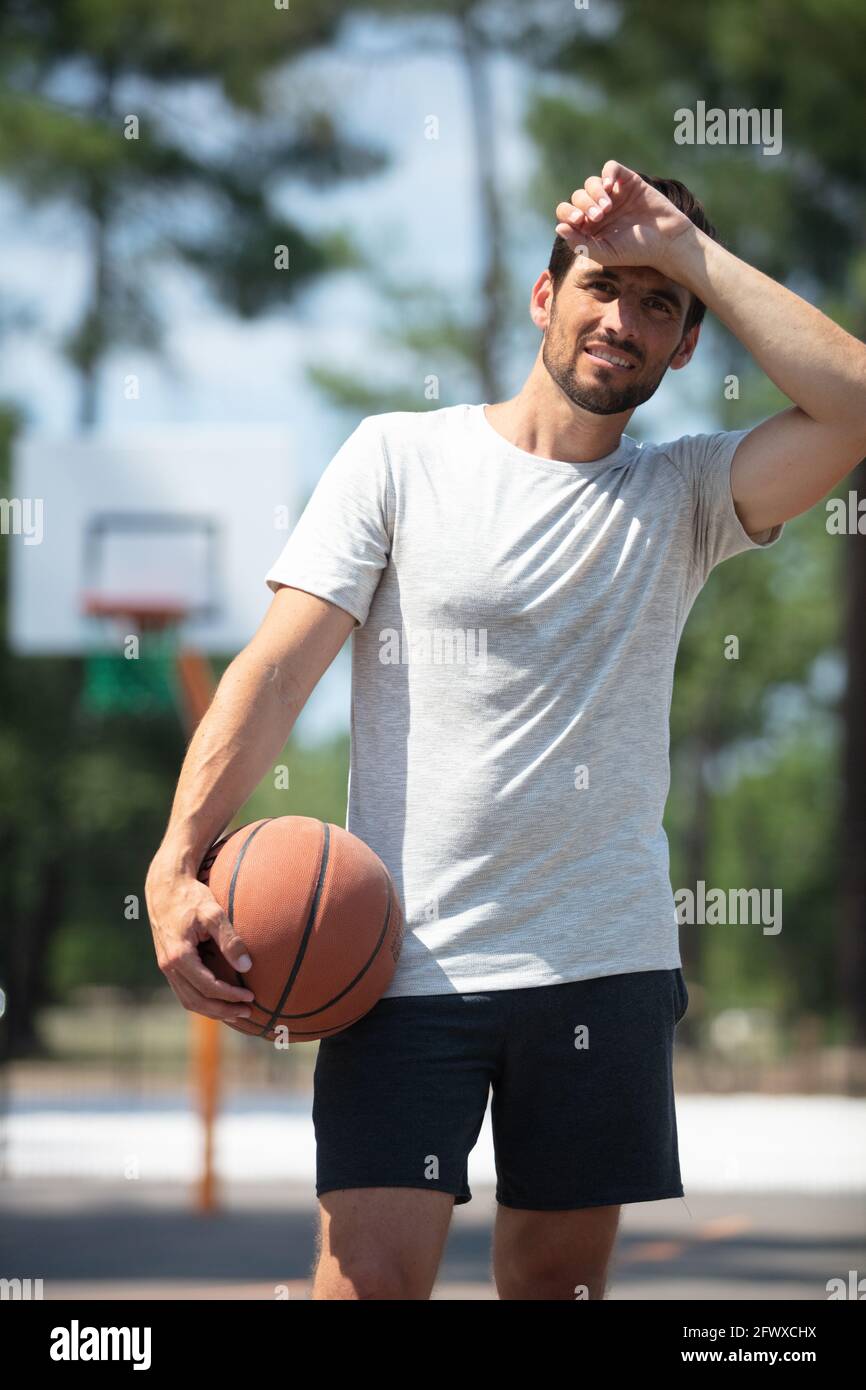 portrait of a man looking at camera at basketball court Stock Photo - Alamy