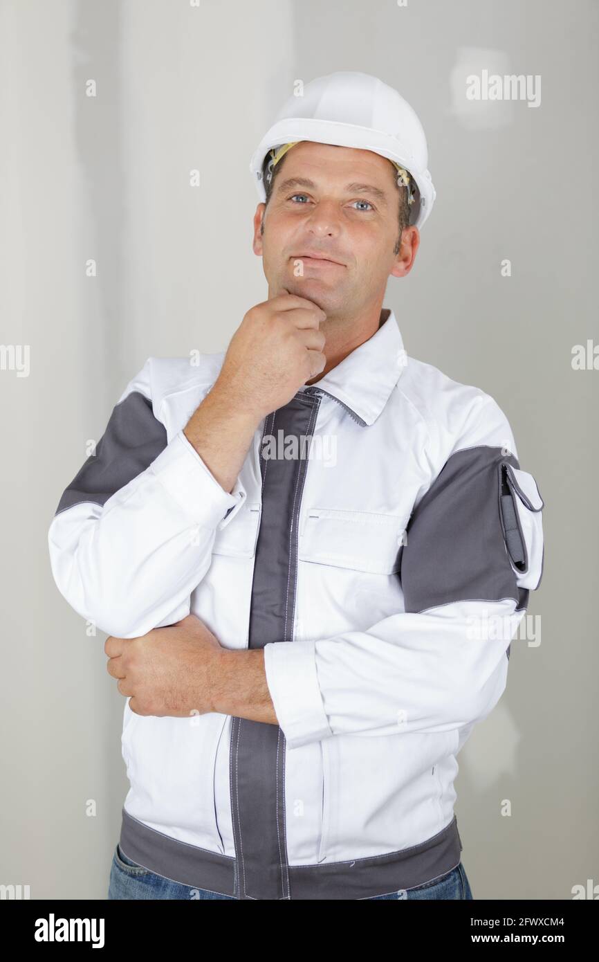 portrait of a thinking builder in uniform Stock Photo - Alamy