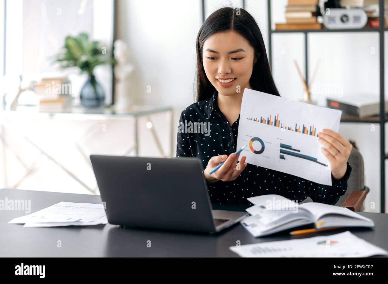 Woman showing financial report during hi-res stock photography and ...