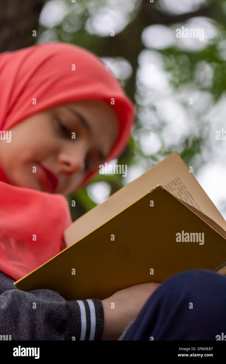 Muslim Girl Reading High Resolution Stock Photography and Images - Alamy