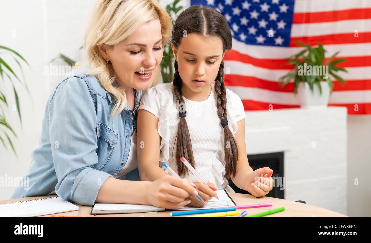 Young girl learning english with teacher Stock Photo - Alamy