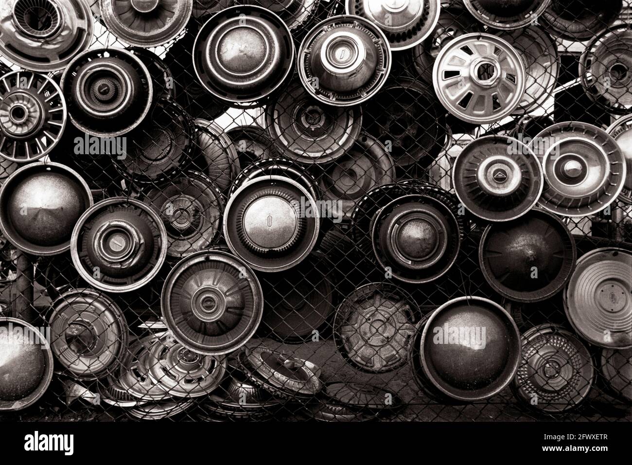 Graveyard of Hubcaps Stock Photo - Alamy