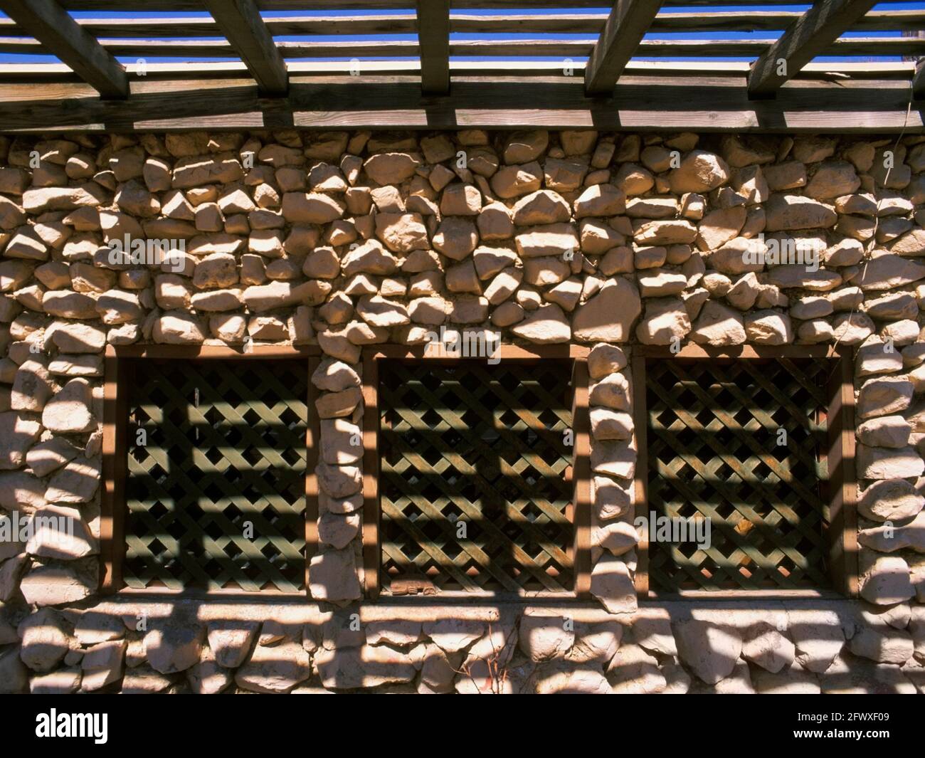 Rock House; Windows; and Shade Arbor Stock Photo - Alamy