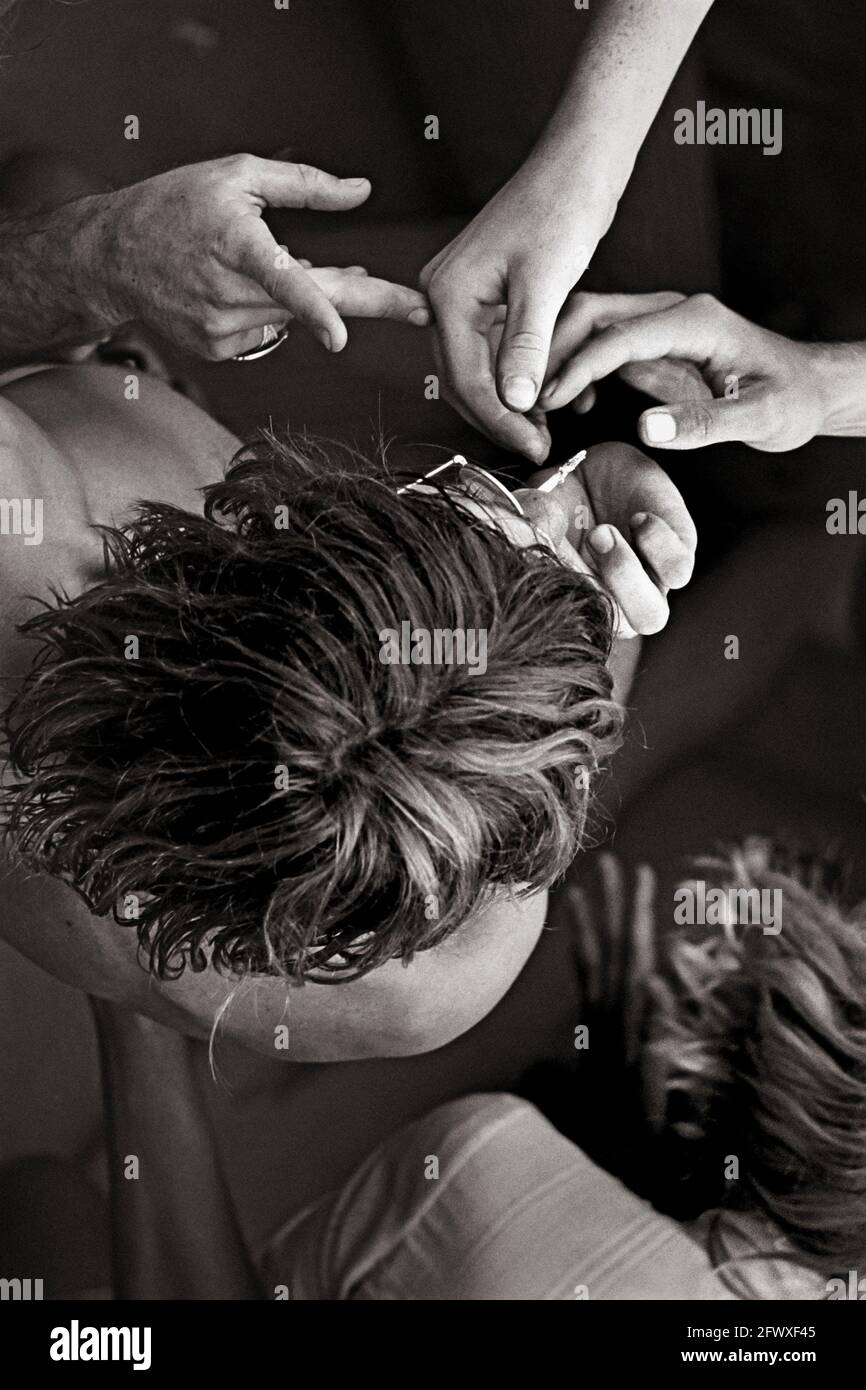 Passing a Marijuana Cigarette - Joint Stock Photo - Alamy