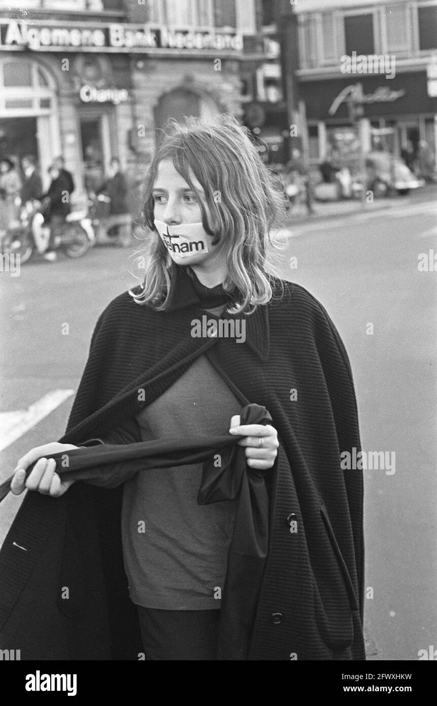 Protest march artists against war in Vietnam, a female participant with ...