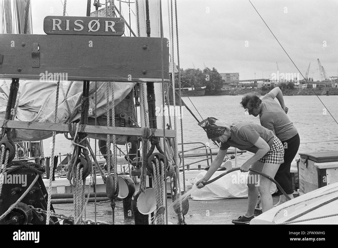 Old English sailing ships on Levantkade in Amsterdam; crew cleans ship ...