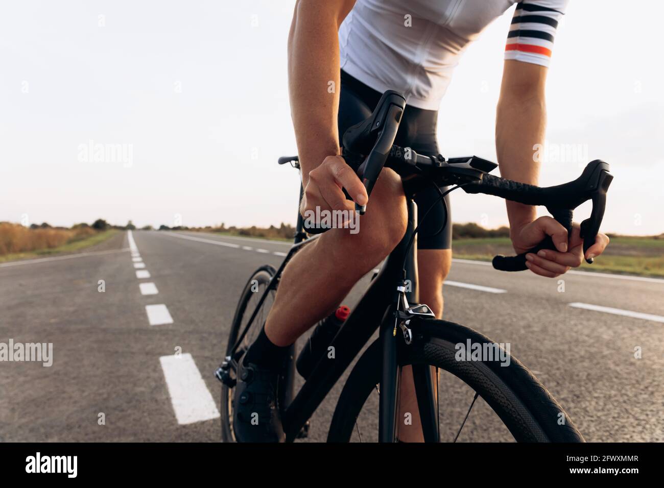 Professional road cyclist posing on camera with bike Stock Photo - Alamy