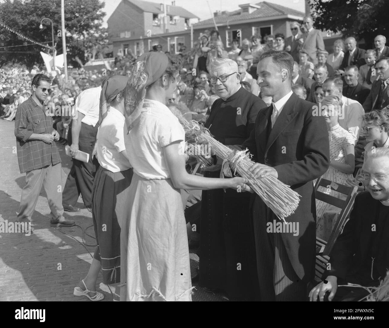 Raalte.Stoppelhaenefeest. Harvest festival, offering sheaves of corn ...
