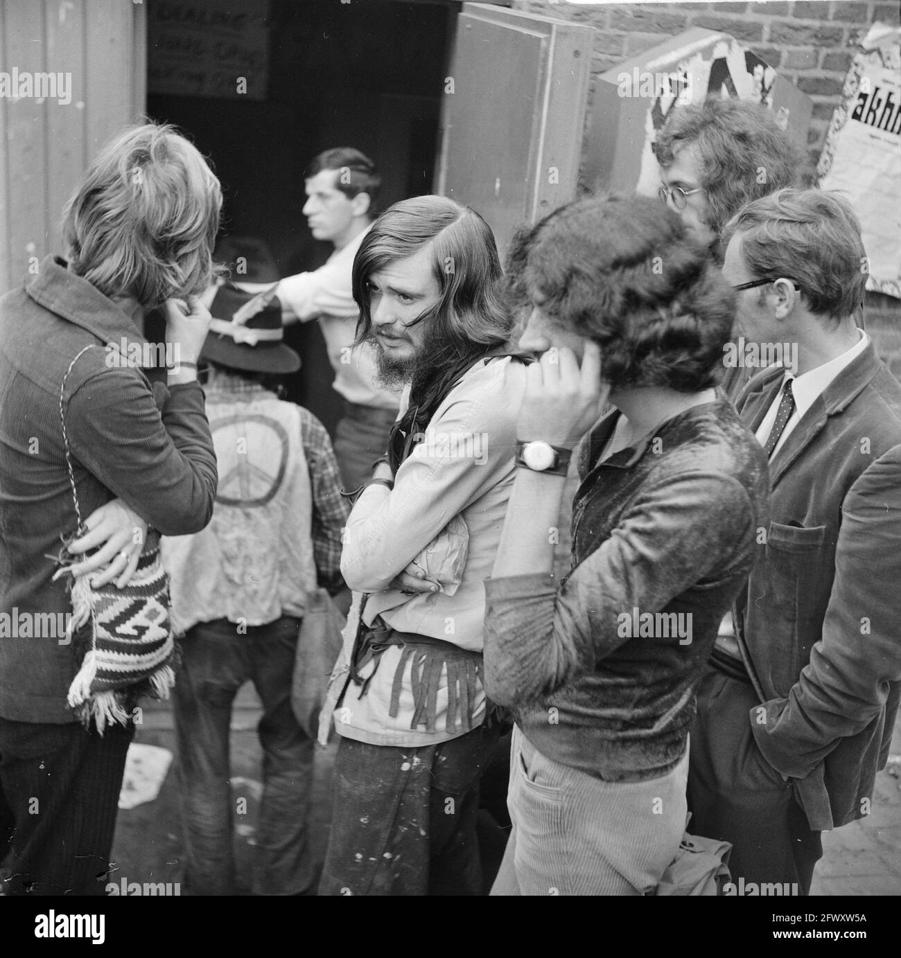 Police detectives (in white jean suits) make arrests in Studio 7 in ...