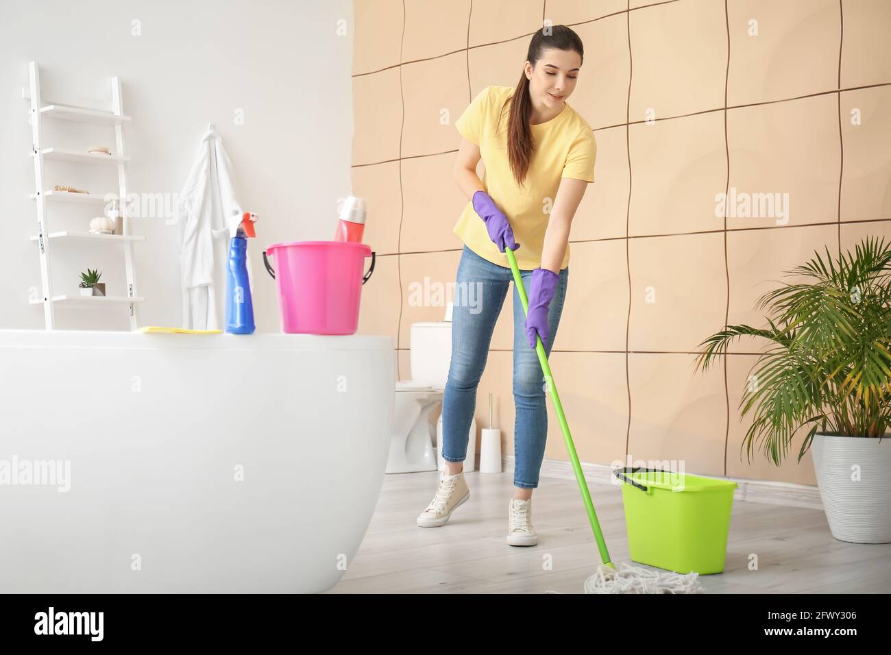 Girl sweeping floor in background hi-res stock photography and images ...