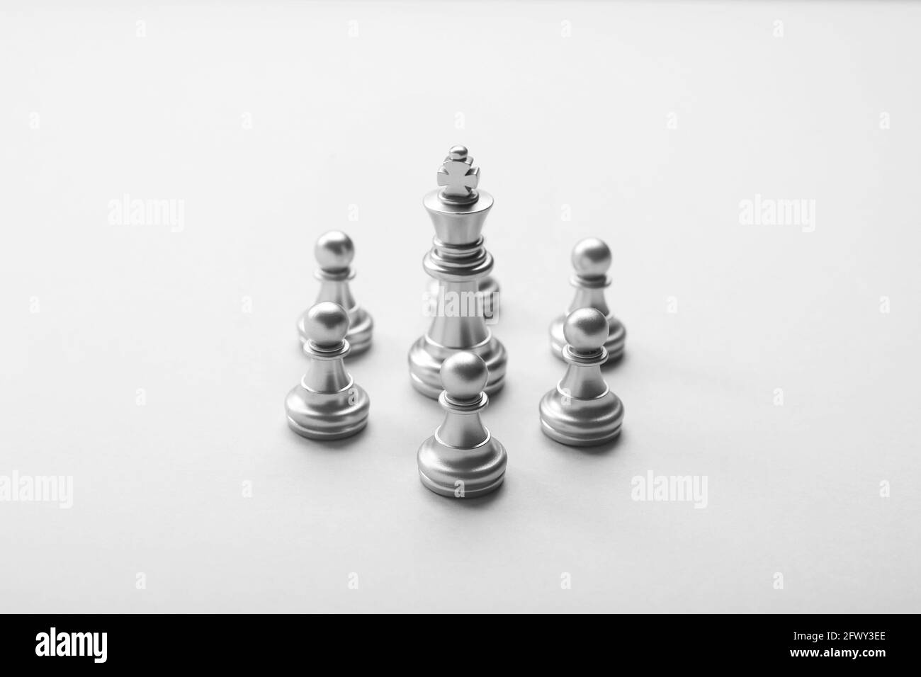 Chess pieces on grey background. Hierarchy concept Stock Photo - Alamy