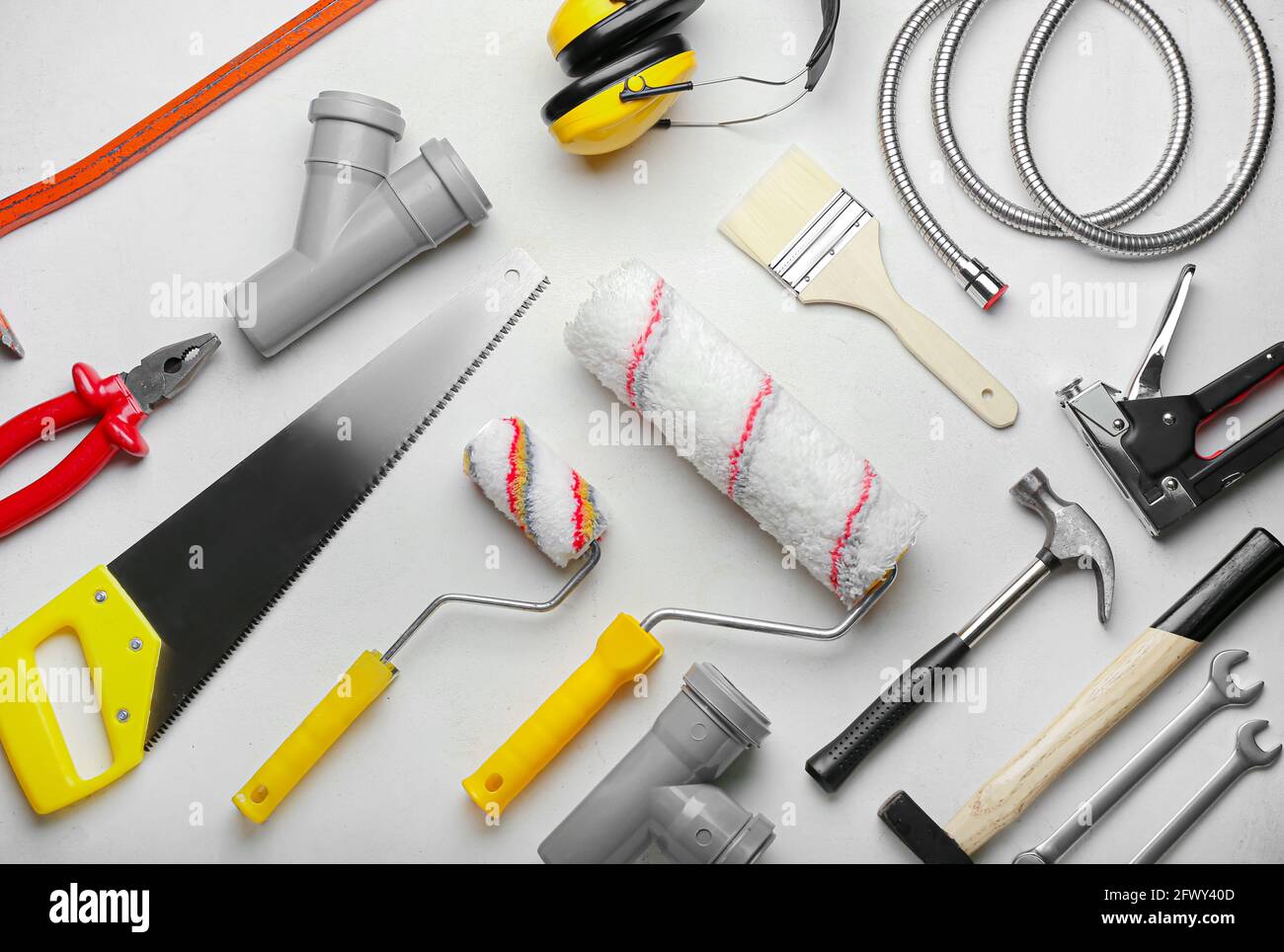 Set of construction tools on light background Stock Photo - Alamy
