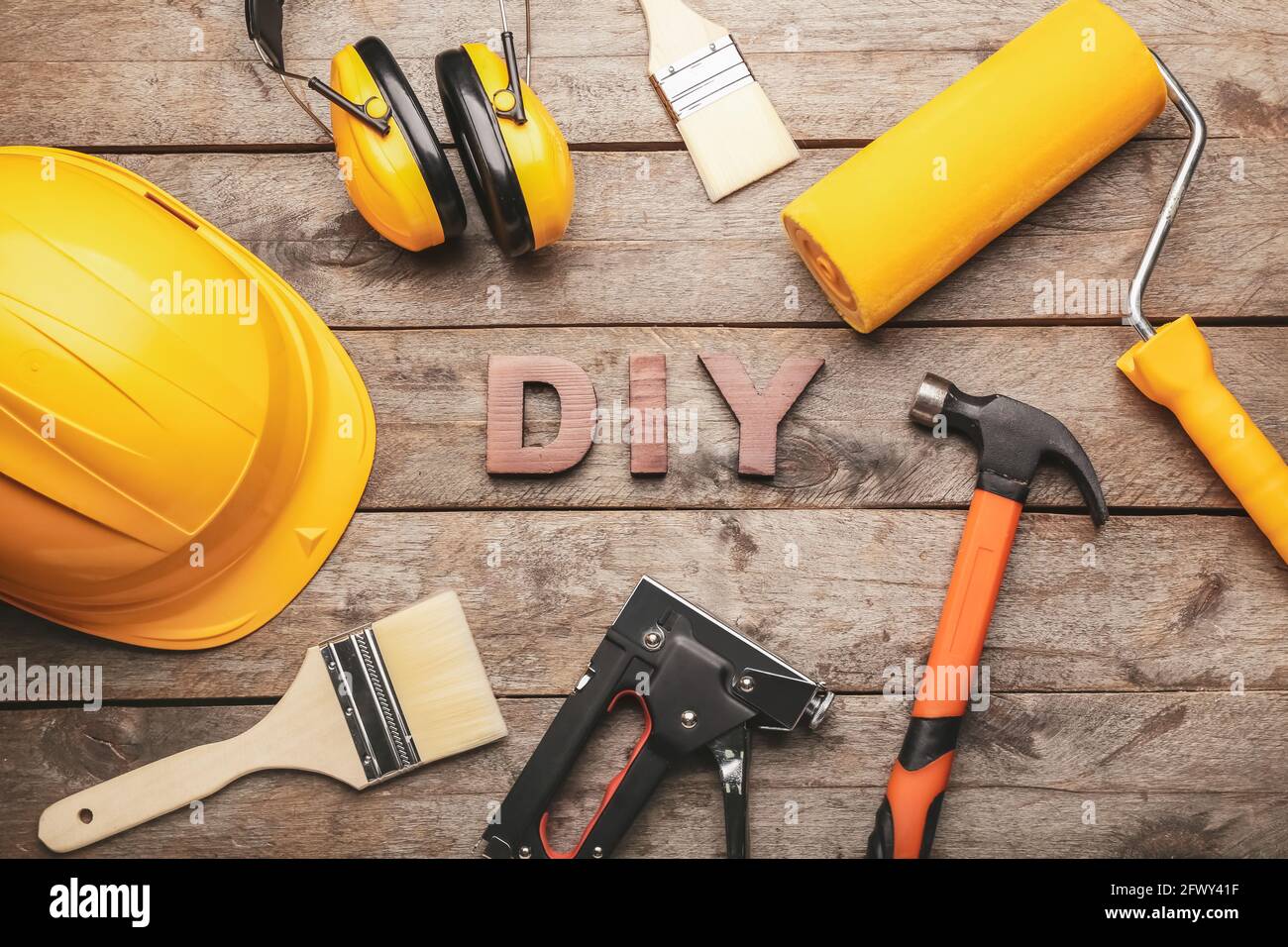 Frame made of tools and word DIY on wooden background Stock Photo - Alamy