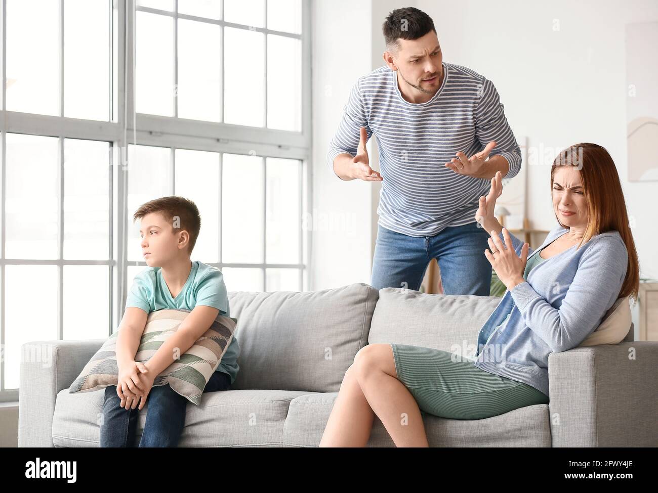 Little boy and his quarrelling parents at home Stock Photo - Alamy