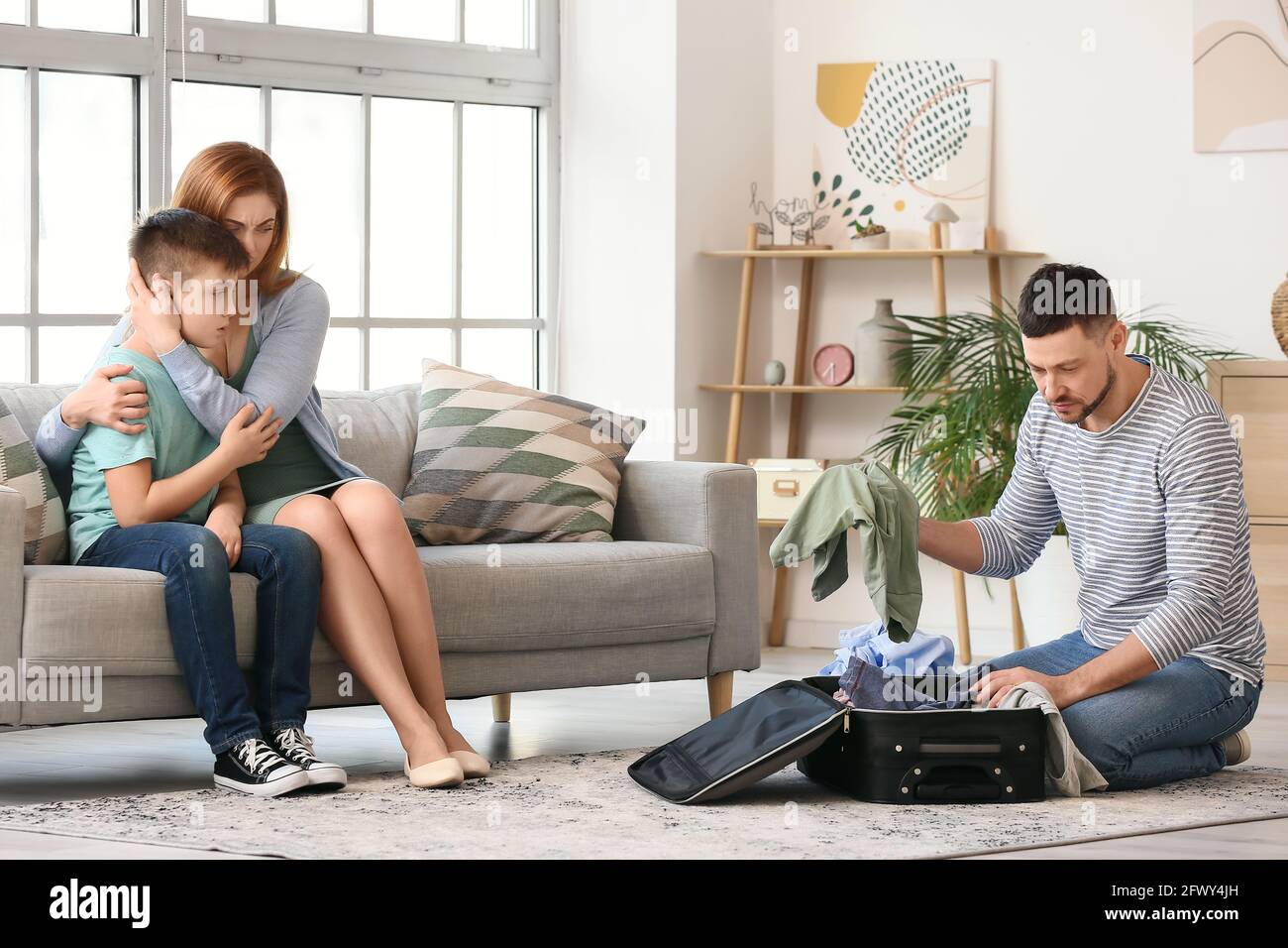 Sad boy suitcase hi-res stock photography and images - Alamy