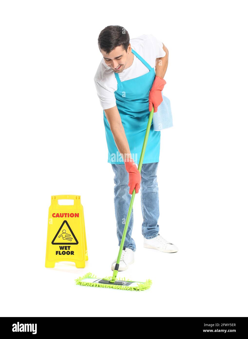 Young man with floor mop and caution sign on white background Stock ...