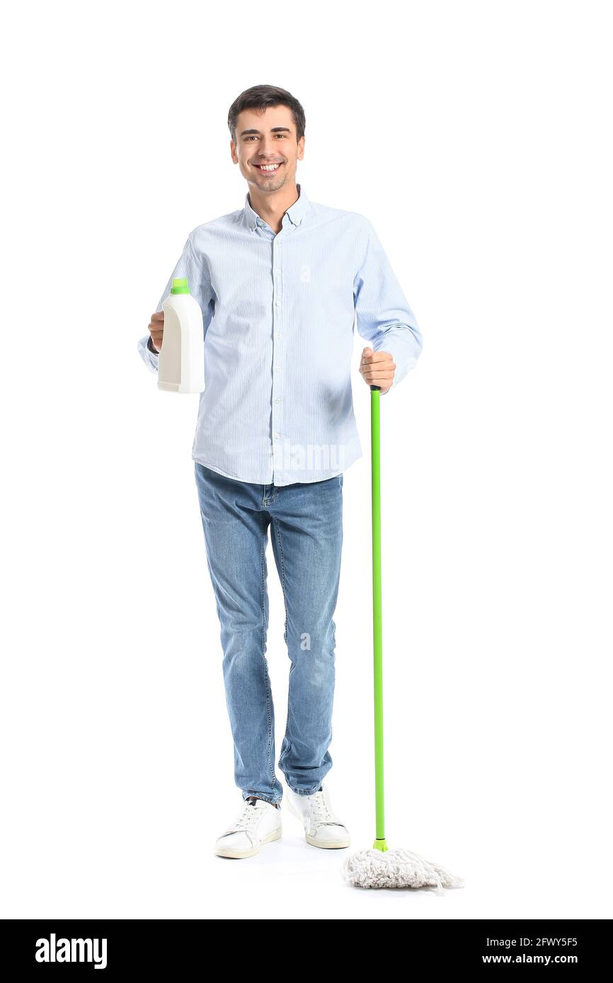 Young man with floor mop and detergent on white background Stock Photo ...