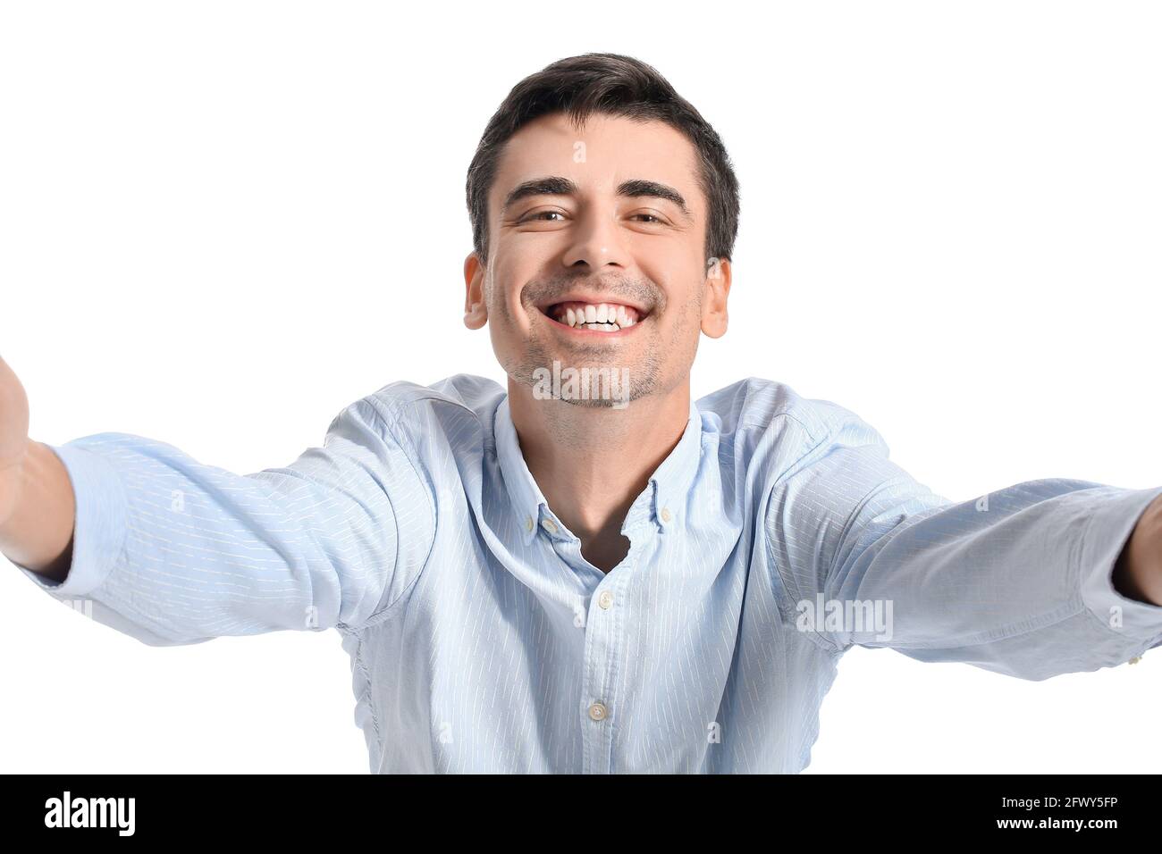 Young man opening arms for hug on white background Stock Photo - Alamy