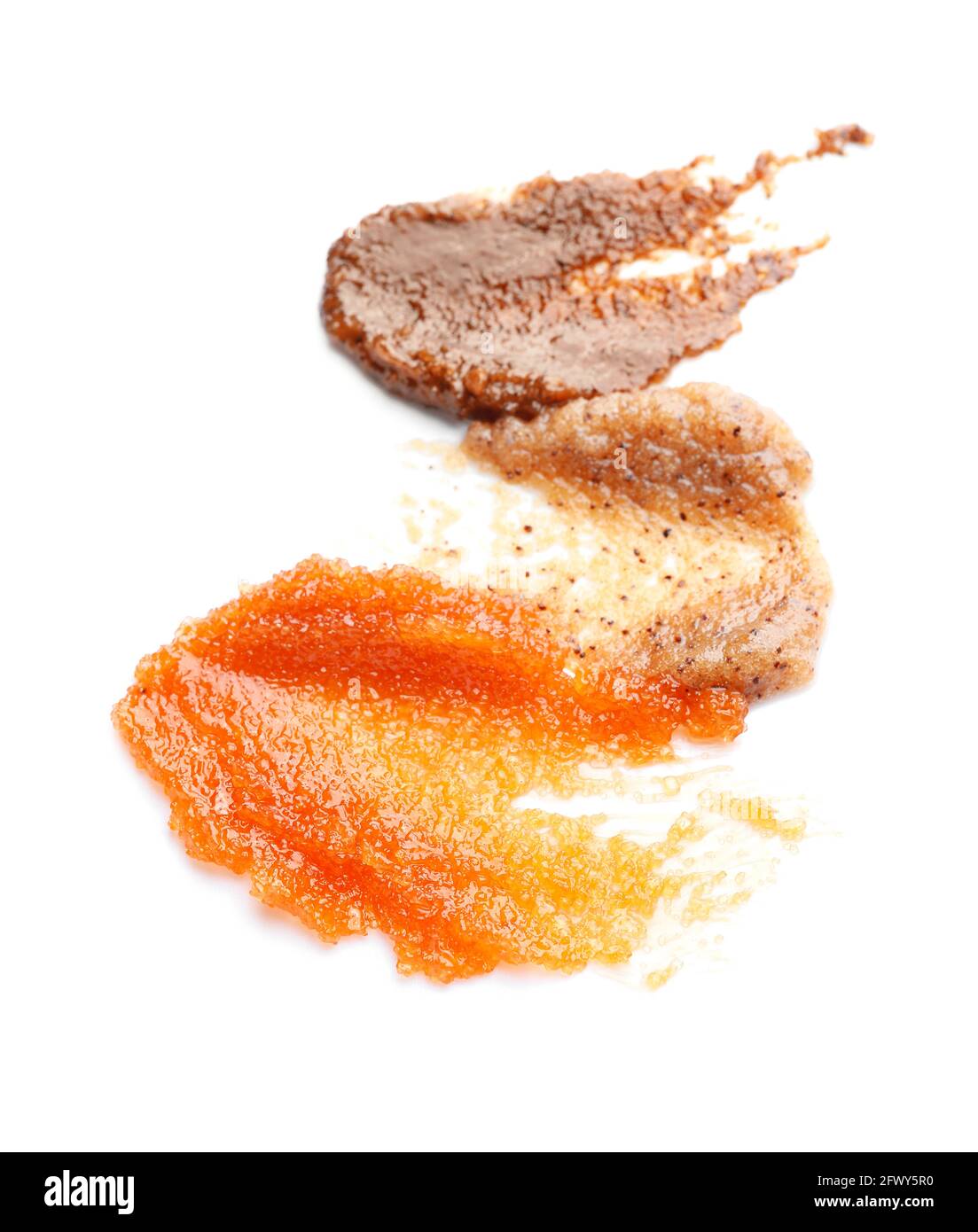 Samples of body scrub on white background Stock Photo - Alamy