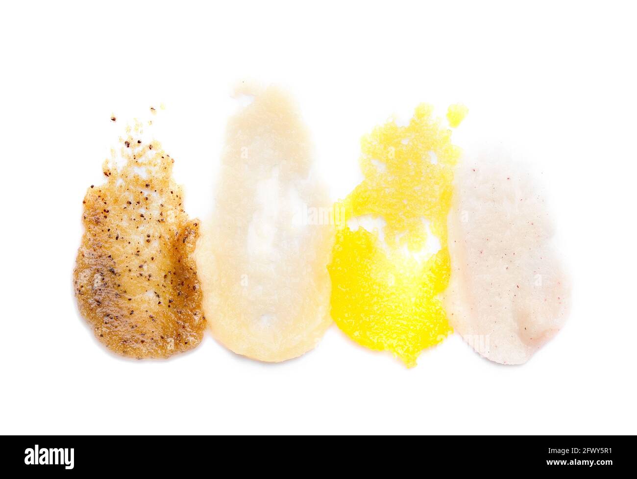 Samples of body scrub on white background Stock Photo - Alamy