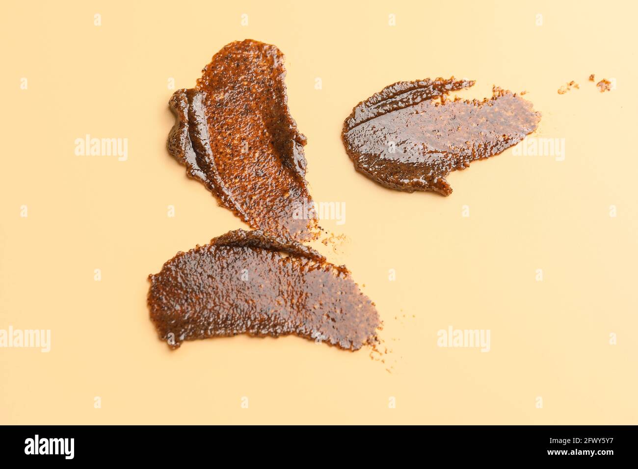 Samples of body scrub on color background Stock Photo - Alamy