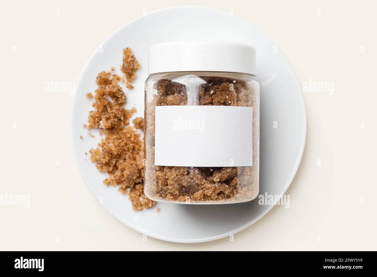Jar of body scrub on light background Stock Photo - Alamy