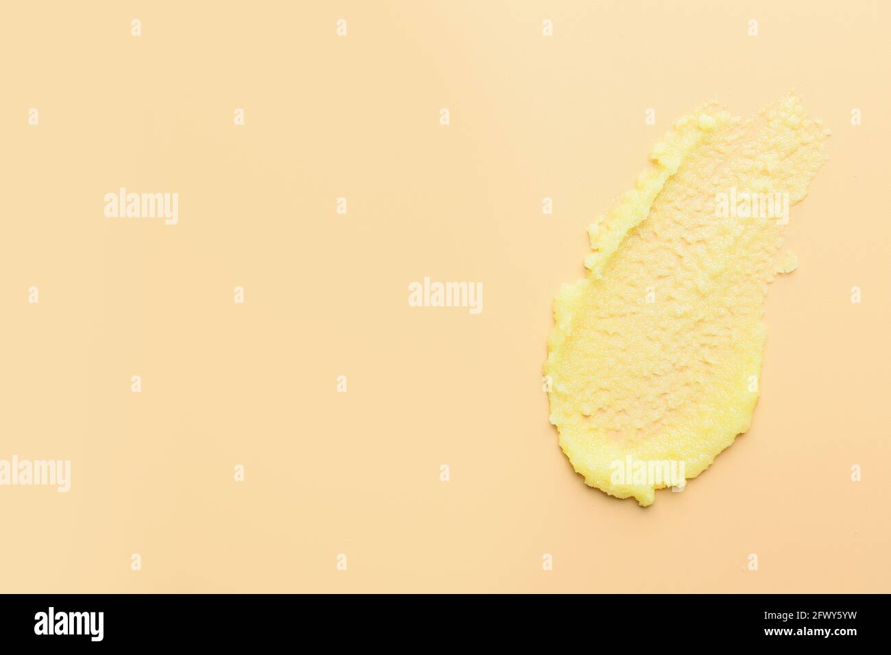 Sample of body scrub on color background Stock Photo - Alamy