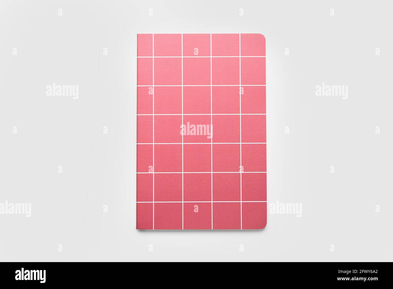 Checkered notebook on white background Stock Photo - Alamy