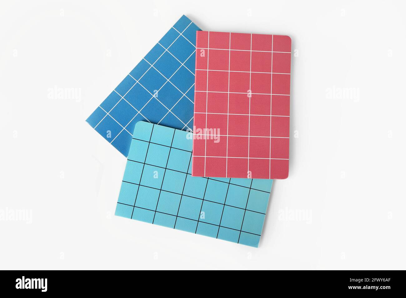 Checkered notebooks on white background Stock Photo - Alamy