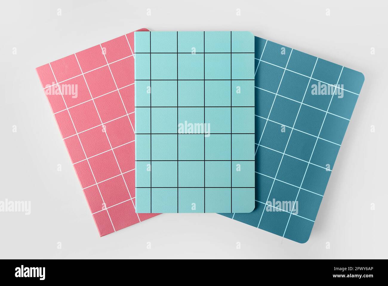 Checkered notebooks on white background Stock Photo - Alamy
