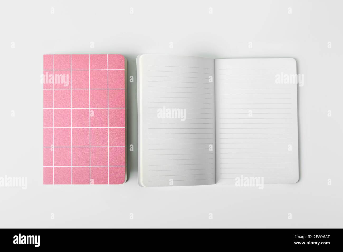 Checkered notebooks on white background Stock Photo - Alamy