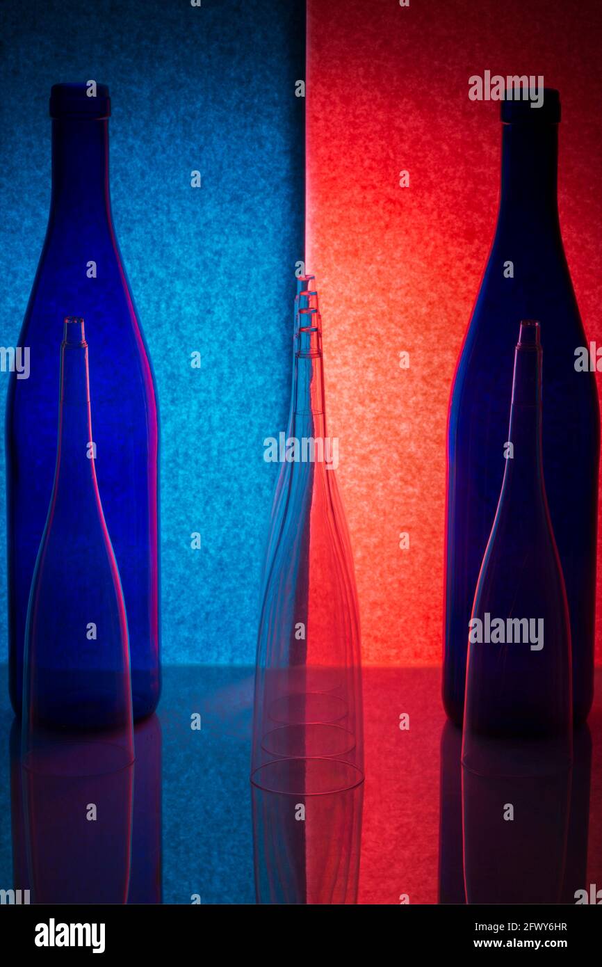 Still life with glass objects on a colored background Stock Photo - Alamy