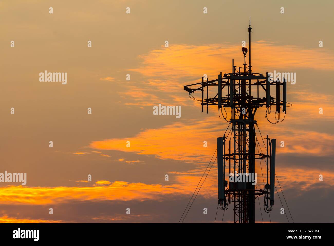 Silhouette Telecommunication tower on sunset background Stock Photo - Alamy
