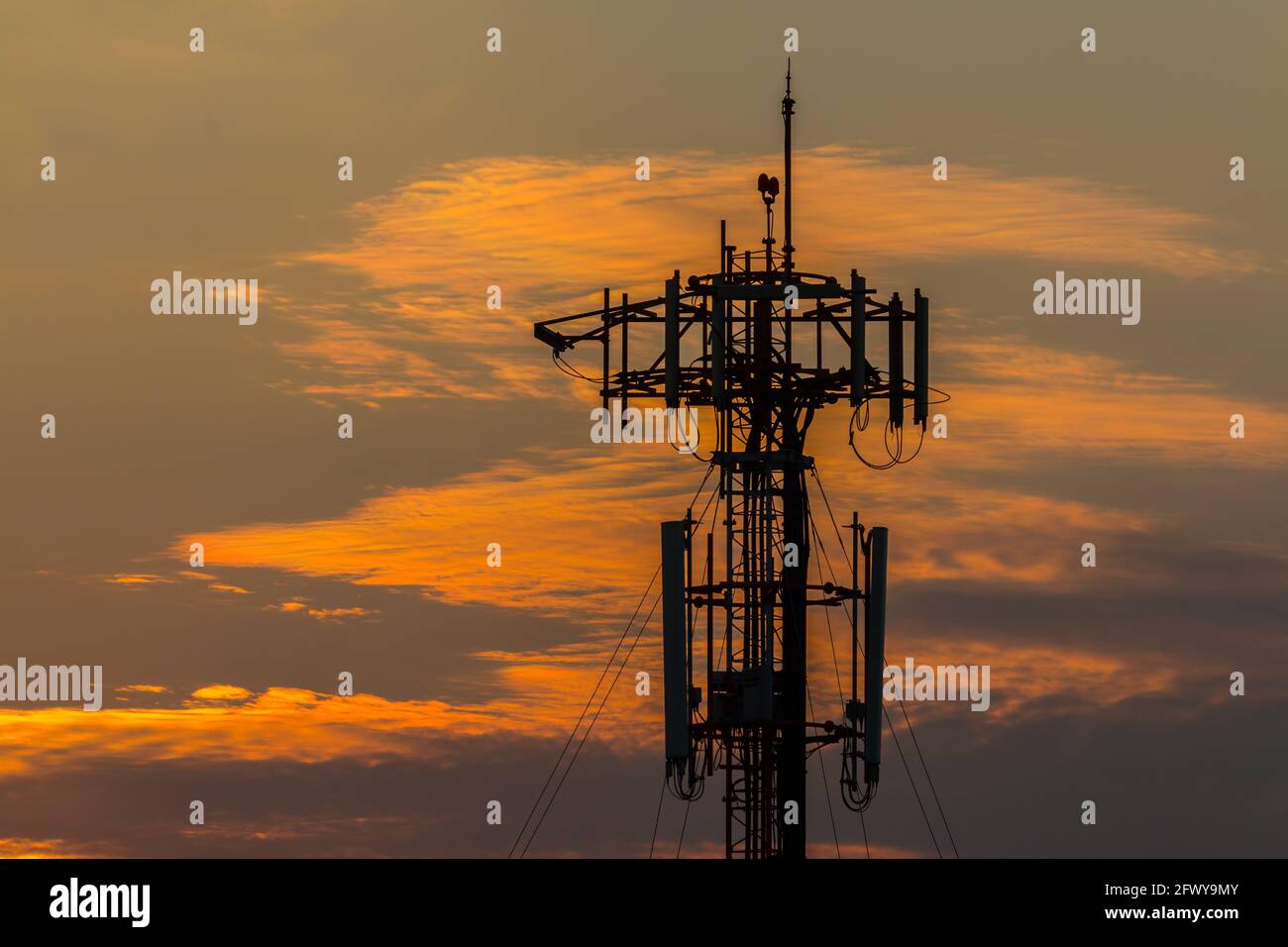 Silhouette Telecommunication tower on sunset background Stock Photo - Alamy