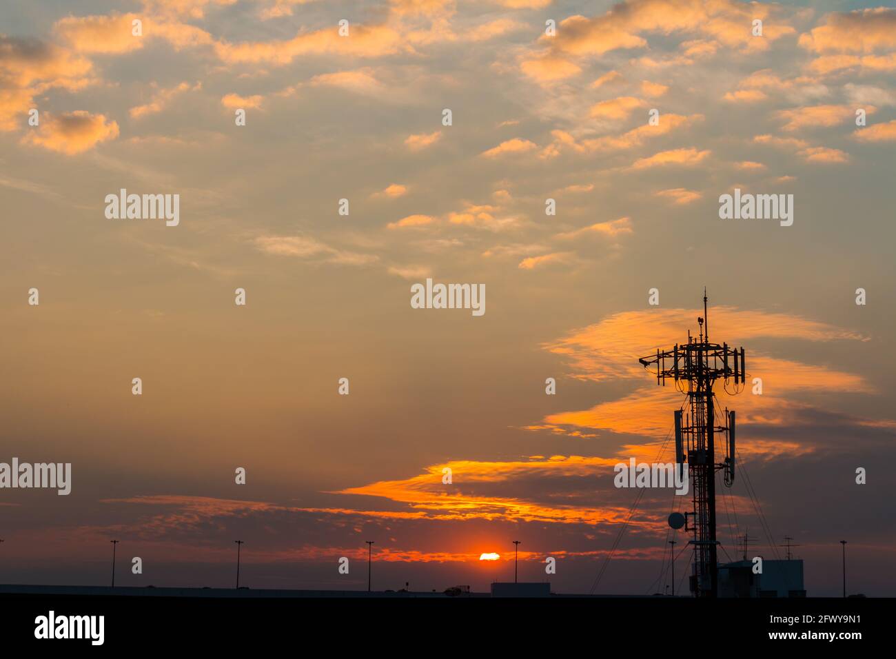 Silhouette Telecommunication tower on sunset background Stock Photo - Alamy