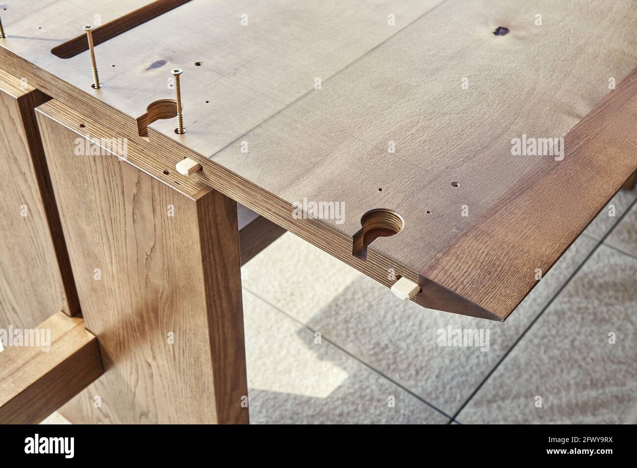 Assembling of large wooden dining table with worktop connectors and ...