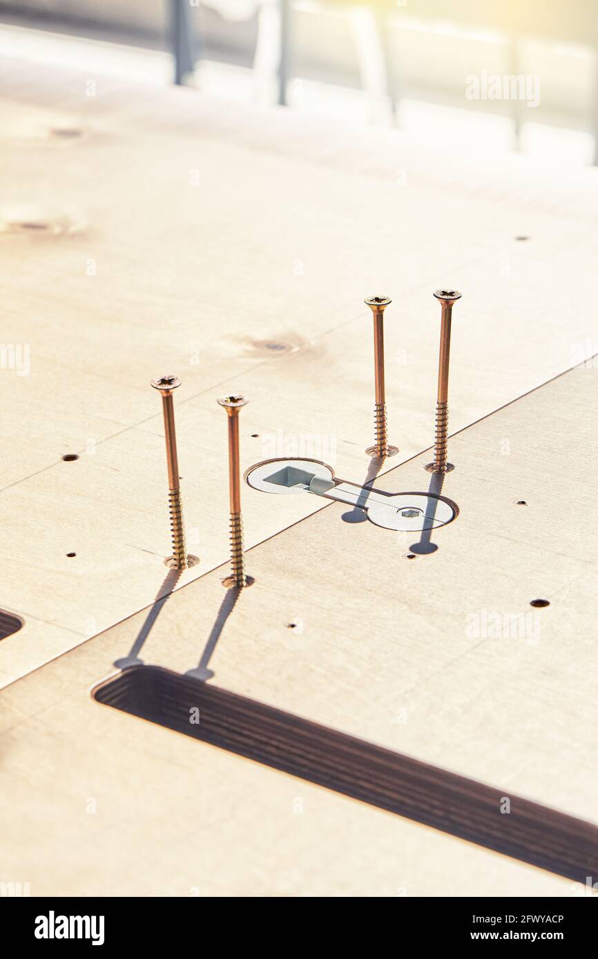 Assembling of large wooden dining table with installed worktop ...