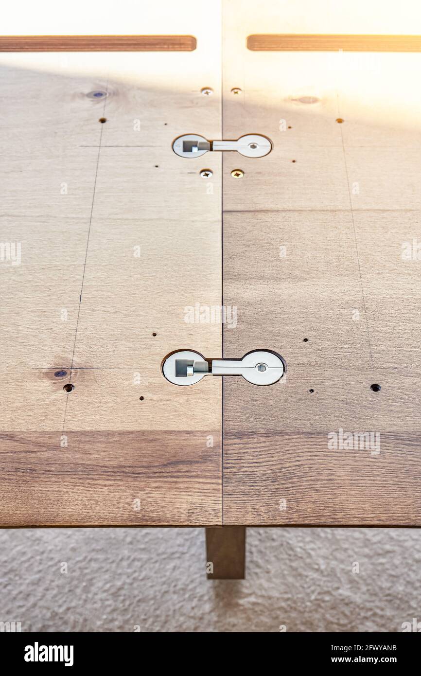 Assembling of large wooden dining table with installed worktop ...