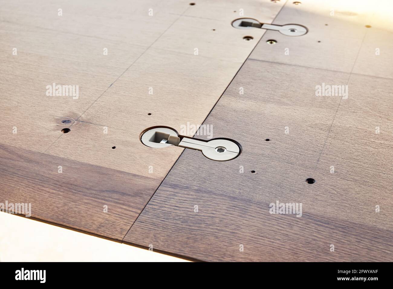 Assembling of large wooden dining table with installed worktop ...