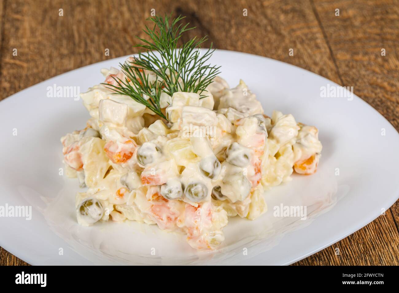 Traditional Russian salad with mayonnaise and meat Stock Photo - Alamy